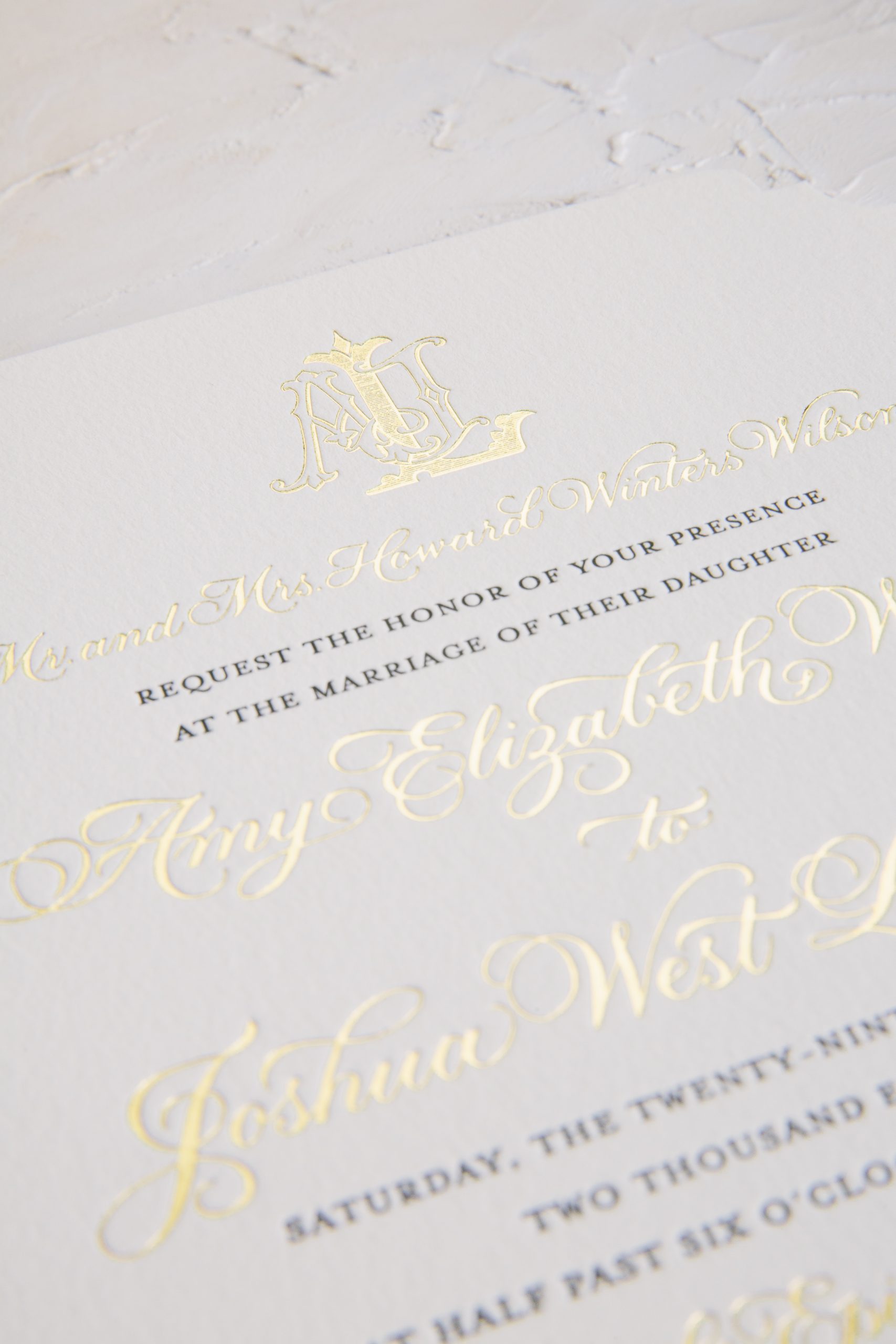 Gold shine wedding invitations with calligraphy accents