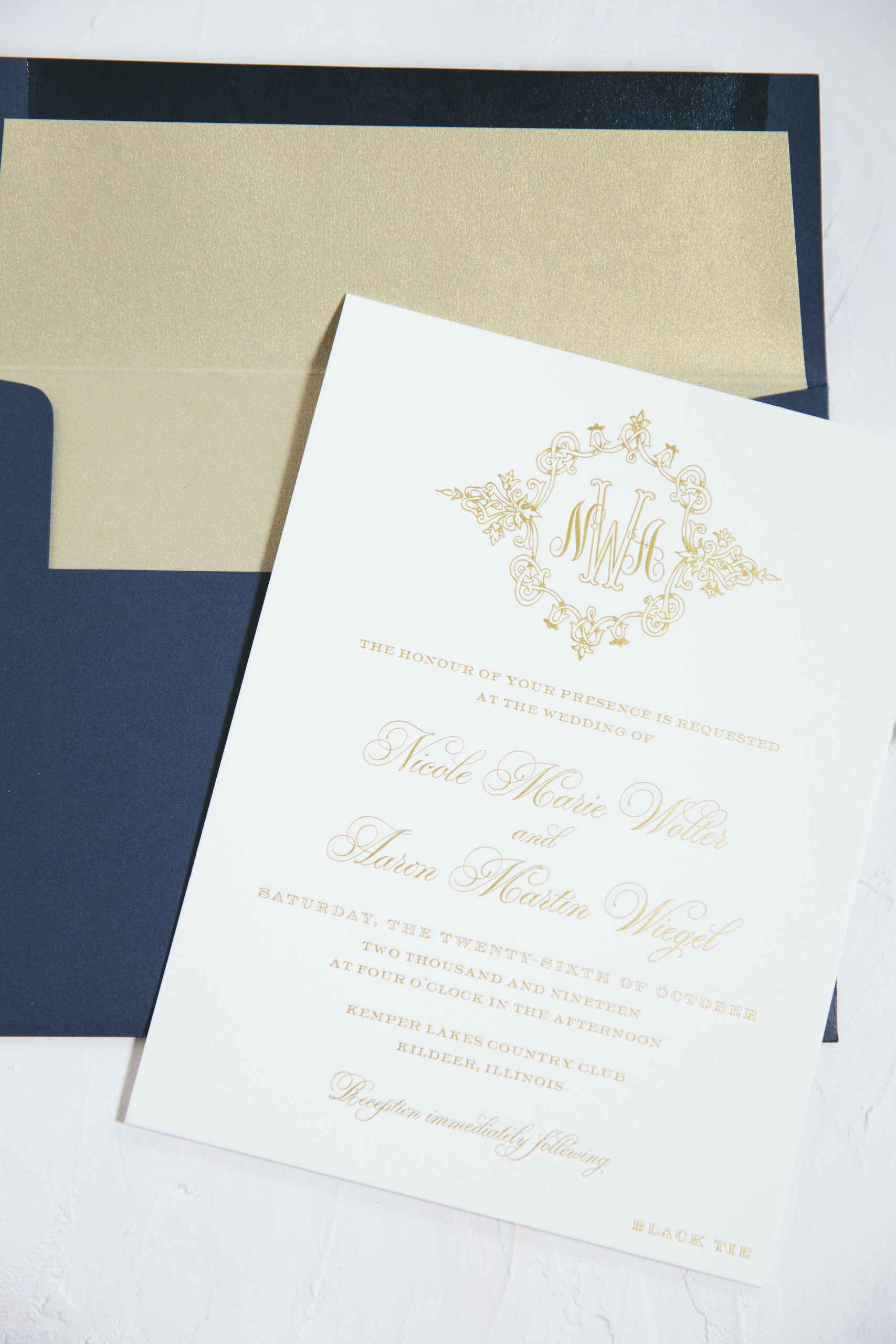 Gold monogrammed wedding invitations from Bella Figura